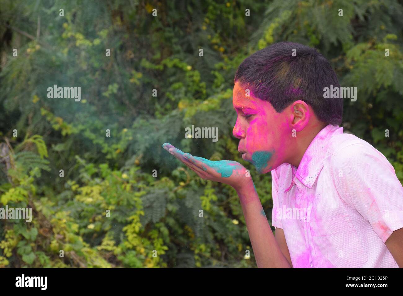 Boy playing with colors, In a happy mood. Concept for Indian festival ...