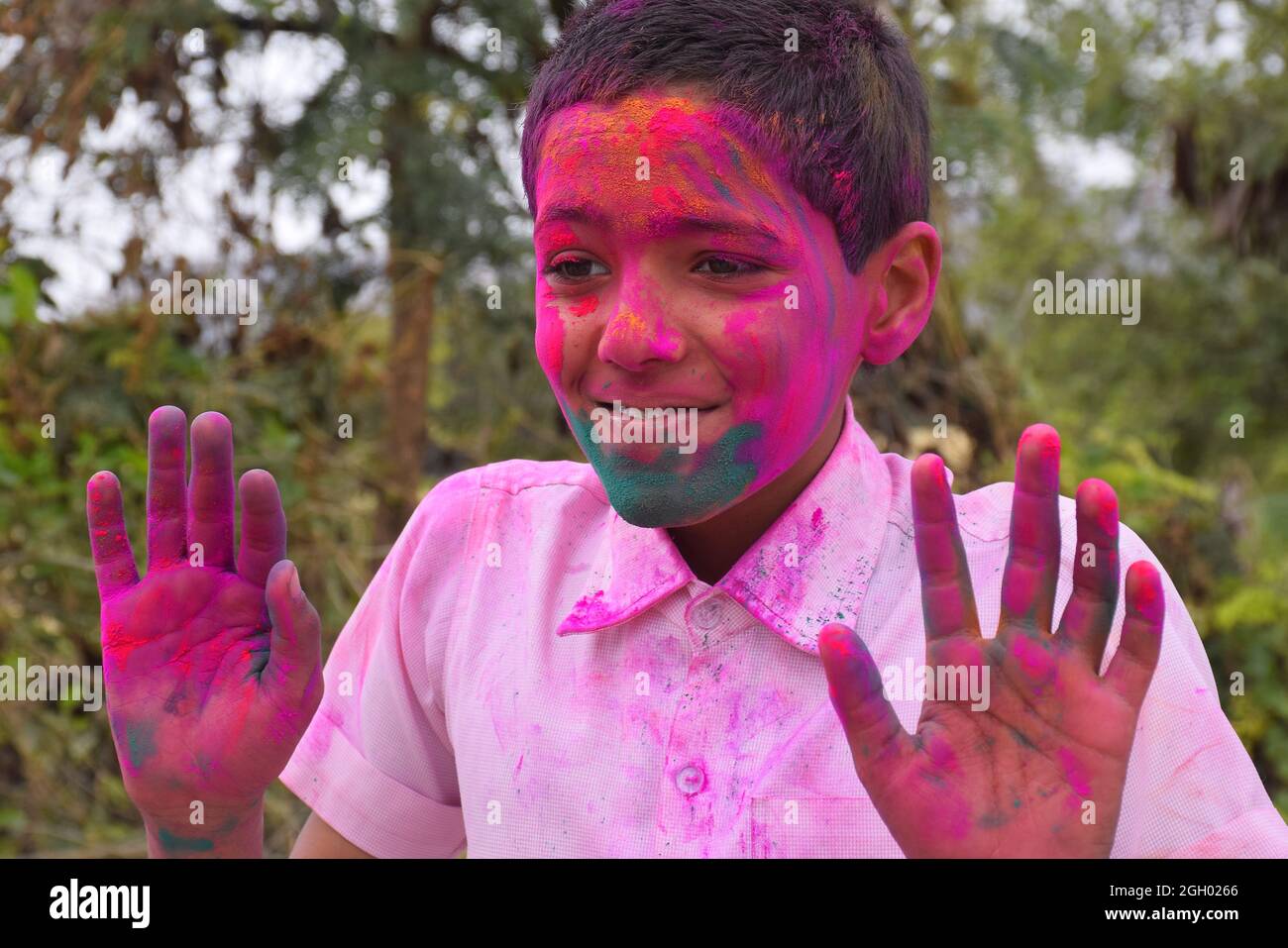 Boy playing with colors, In a happy mood. Concept for Indian festival ...