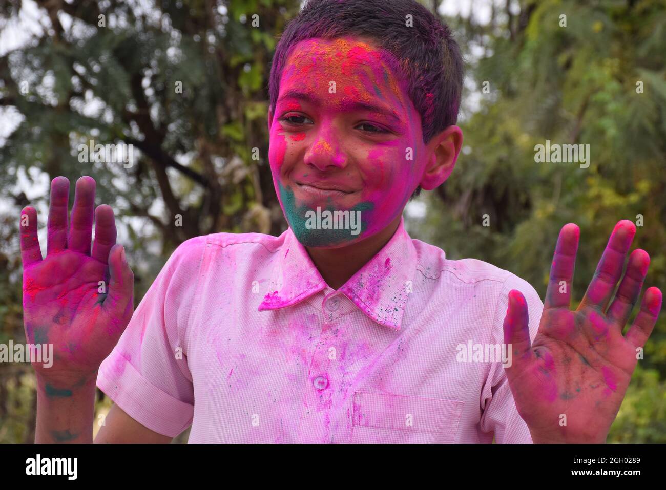Boy playing with colors, In a happy mood. Concept for Indian festival ...