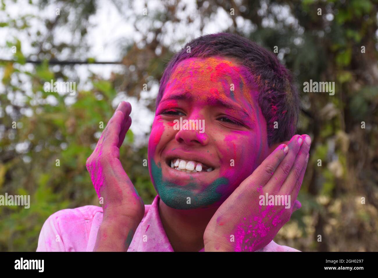 Boy playing with colors, In a happy mood. Concept for Indian festival ...