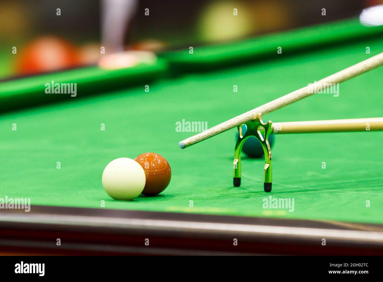 Snooker ball and rest stick Stock Photo - Alamy