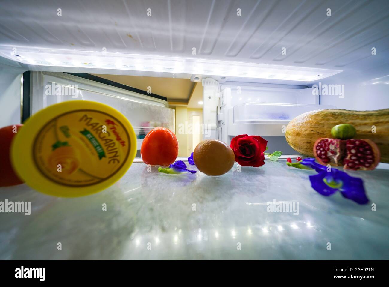 Food inside refrigerator in the kitchen Stock Photo - Alamy