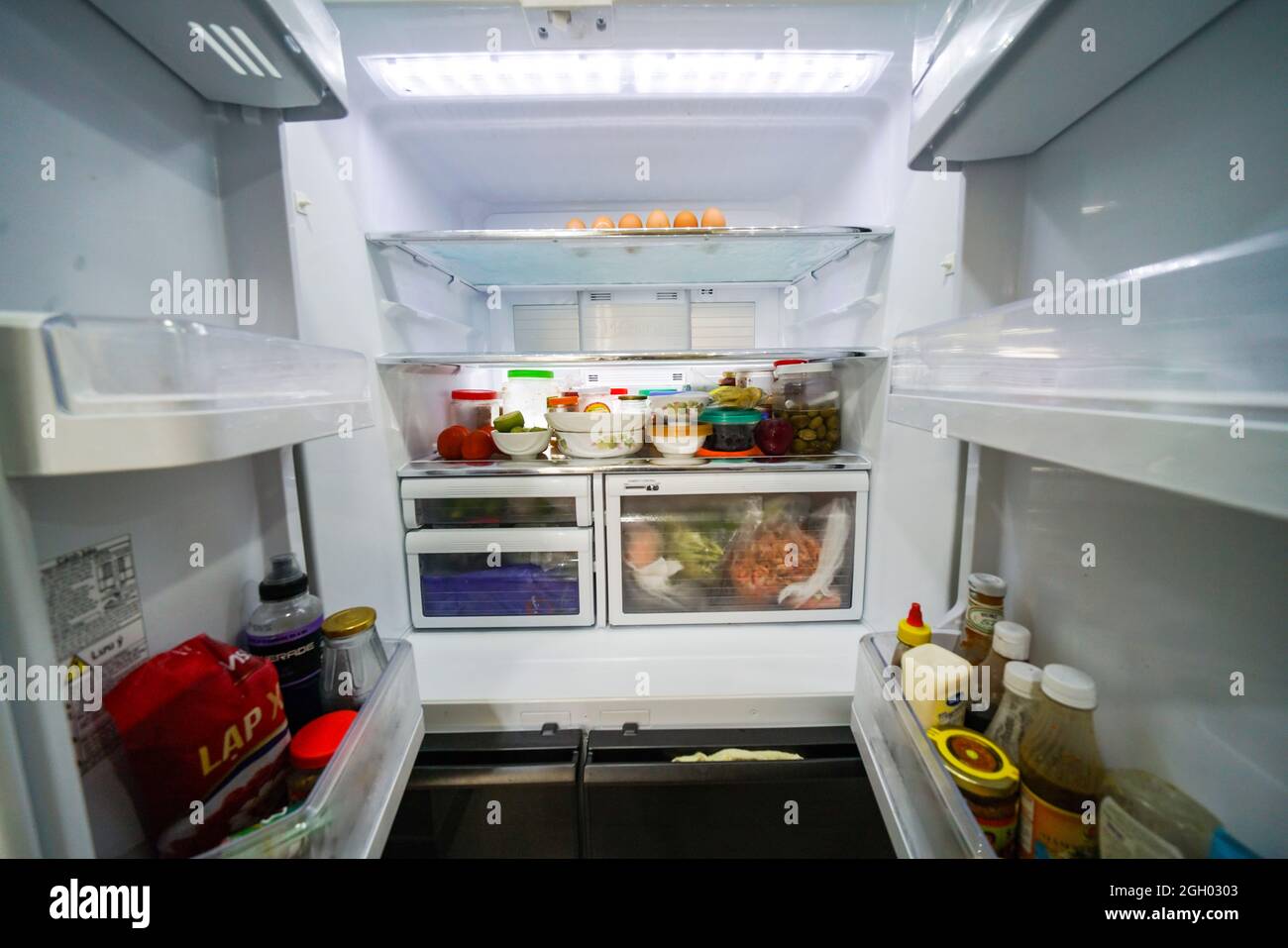 Food inside refrigerator in the kitchen Stock Photo - Alamy