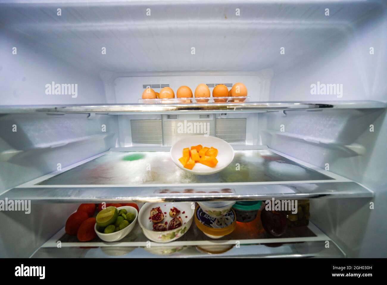 Food inside refrigerator in the kitchen Stock Photo - Alamy