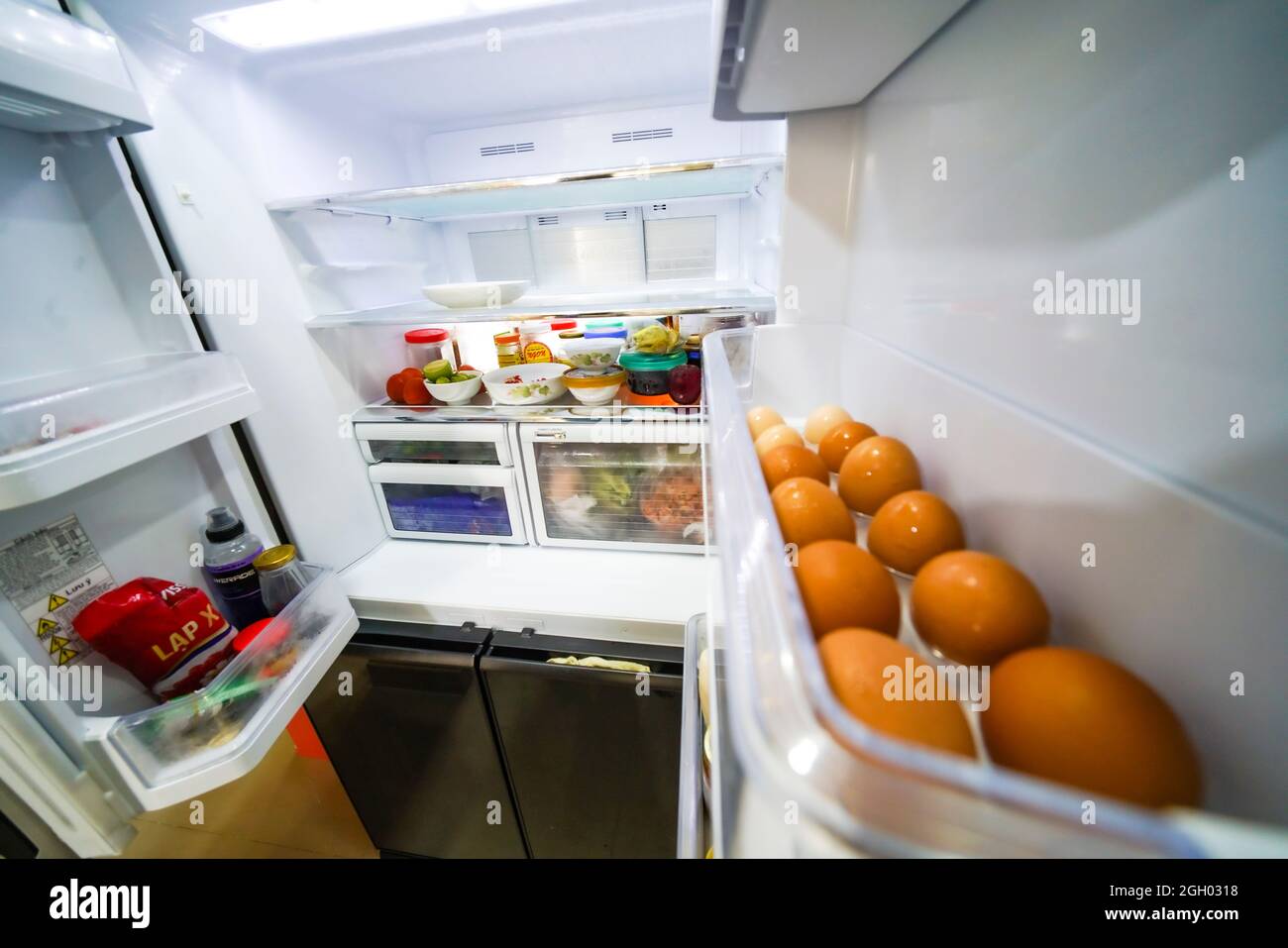 Food inside refrigerator in the kitchen Stock Photo - Alamy