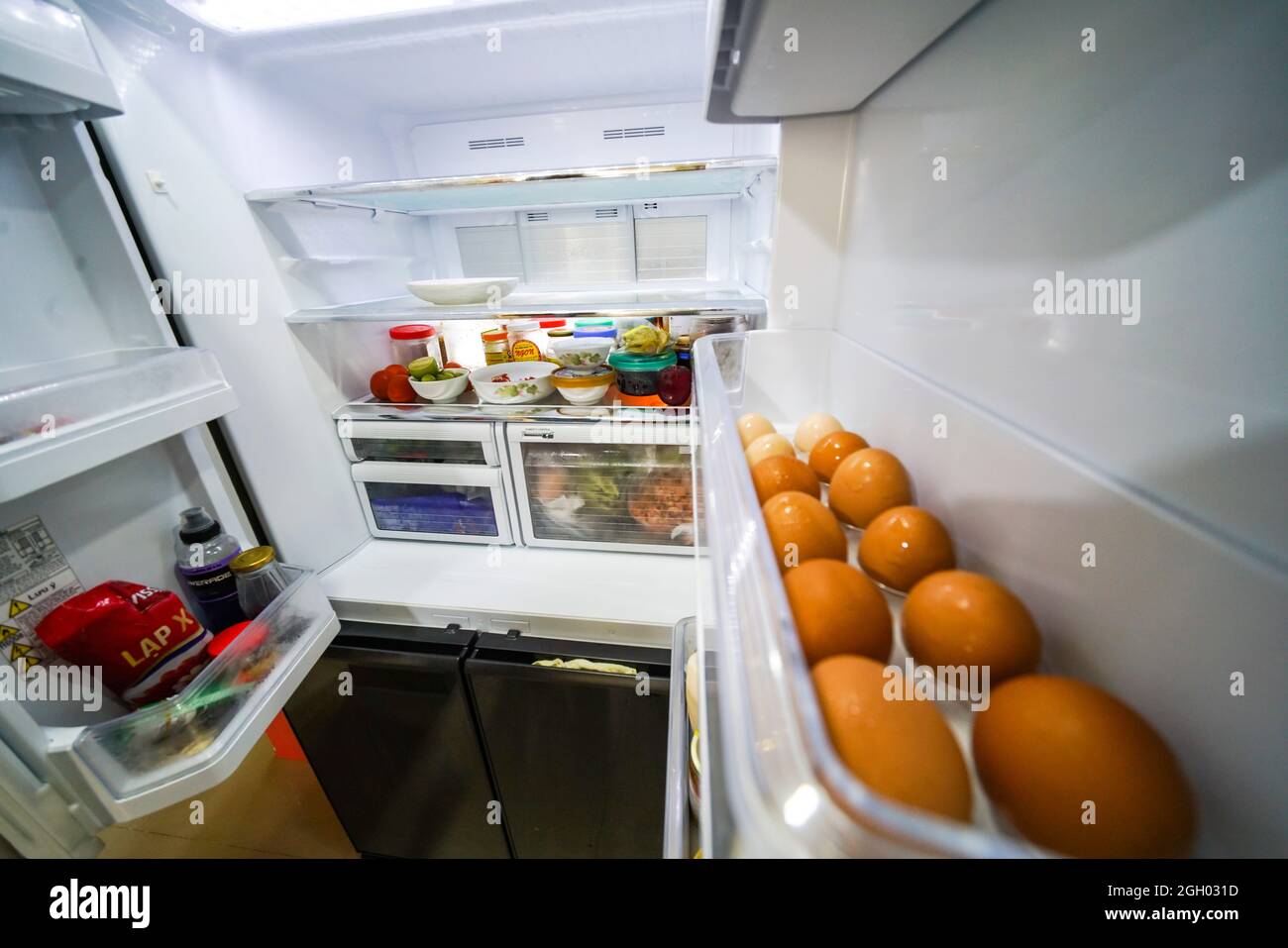 Food inside refrigerator in the kitchen Stock Photo - Alamy