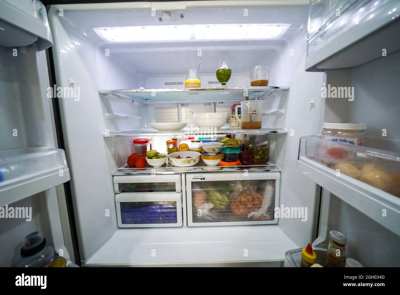 Food inside refrigerator in the kitchen Stock Photo - Alamy