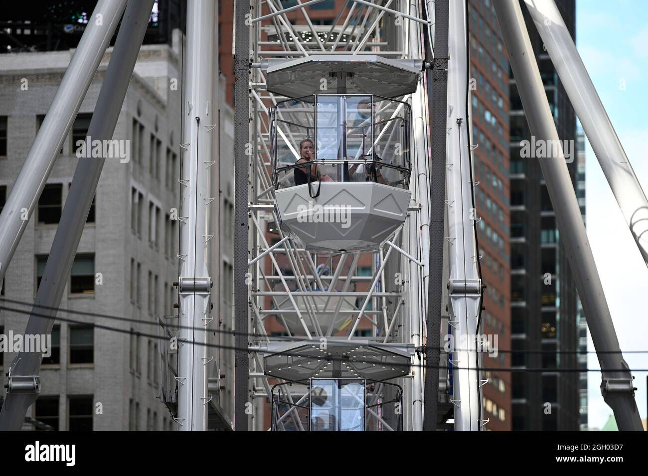 New York City, USA. 03rd Sep, 2021. People are seen riding a ferris ...