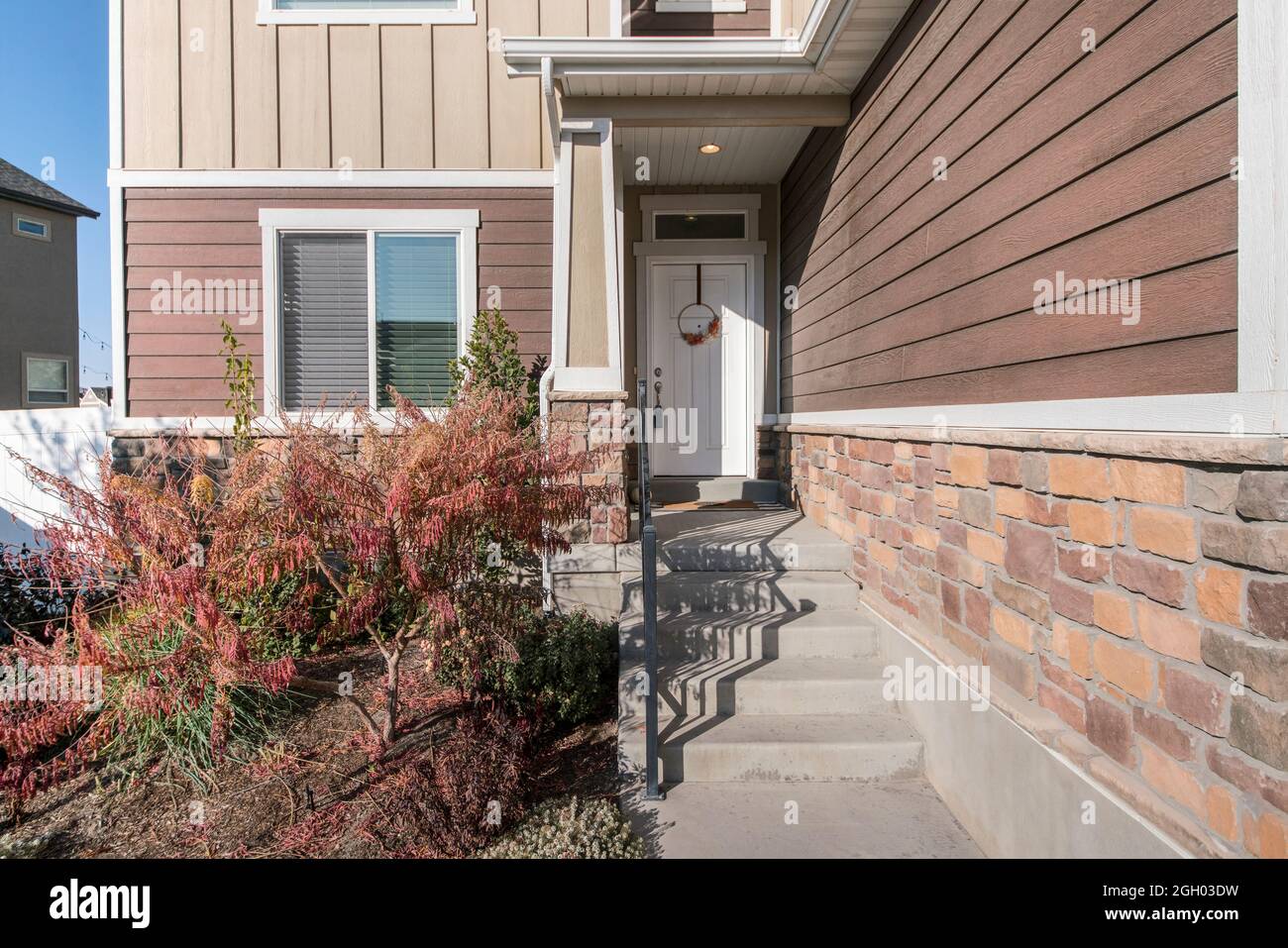 Front exterior of a house with messy front yard garden Stock Photo - Alamy