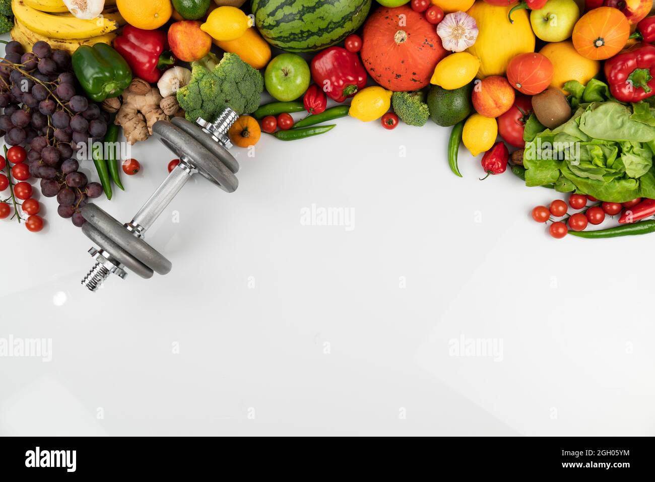 Fitness concept. Healthy nutrition: fruits and vegetables. Equipment ...