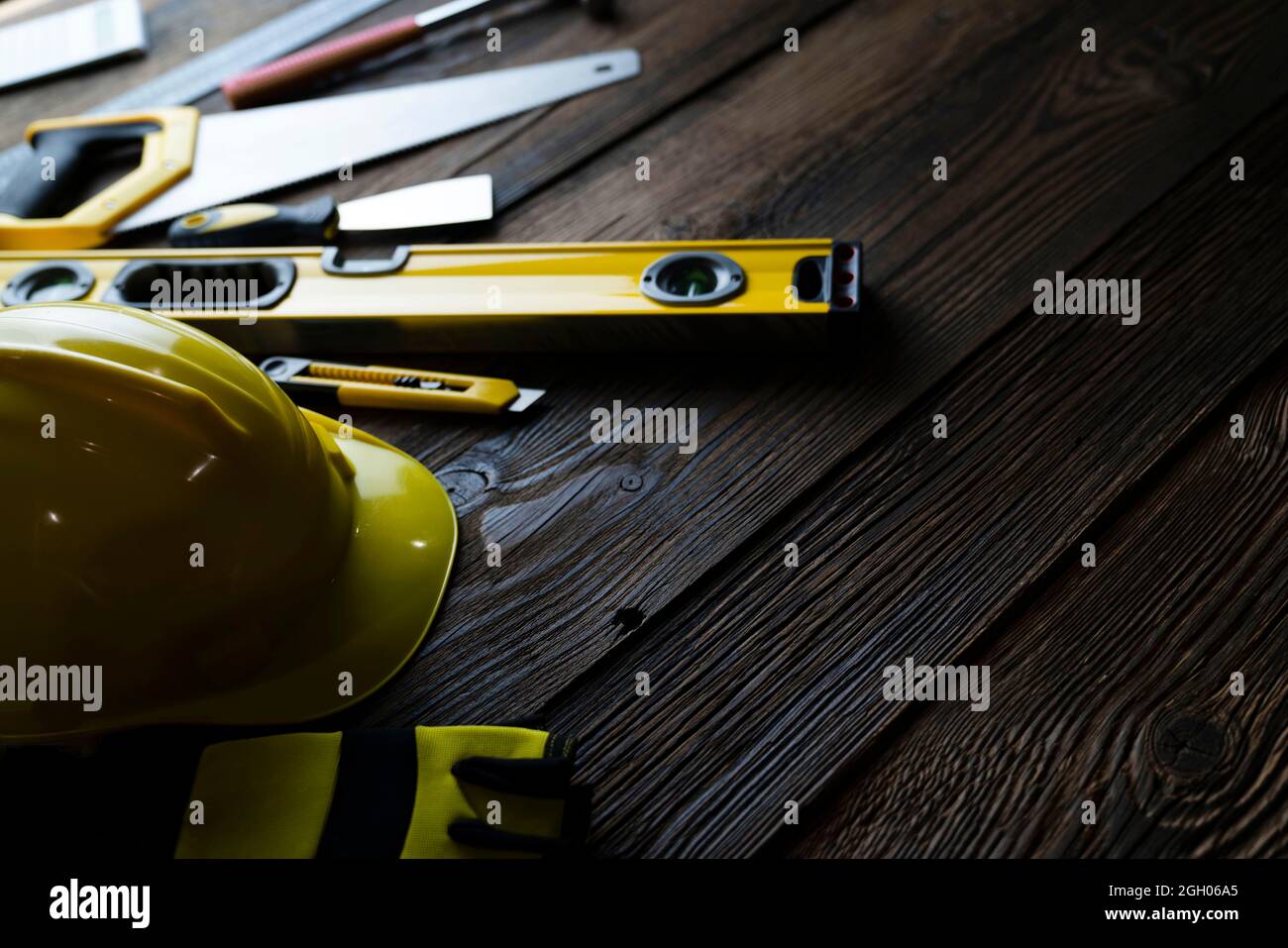 Contractor concept. Tools of the contractor: yellow hardhat, libella ...