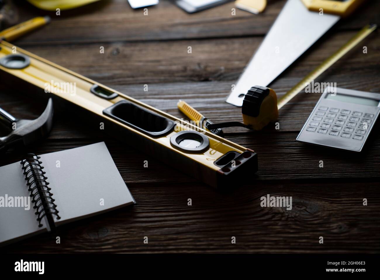 Contractor concept. Tools of the contractor: yellow hardhat, libella ...