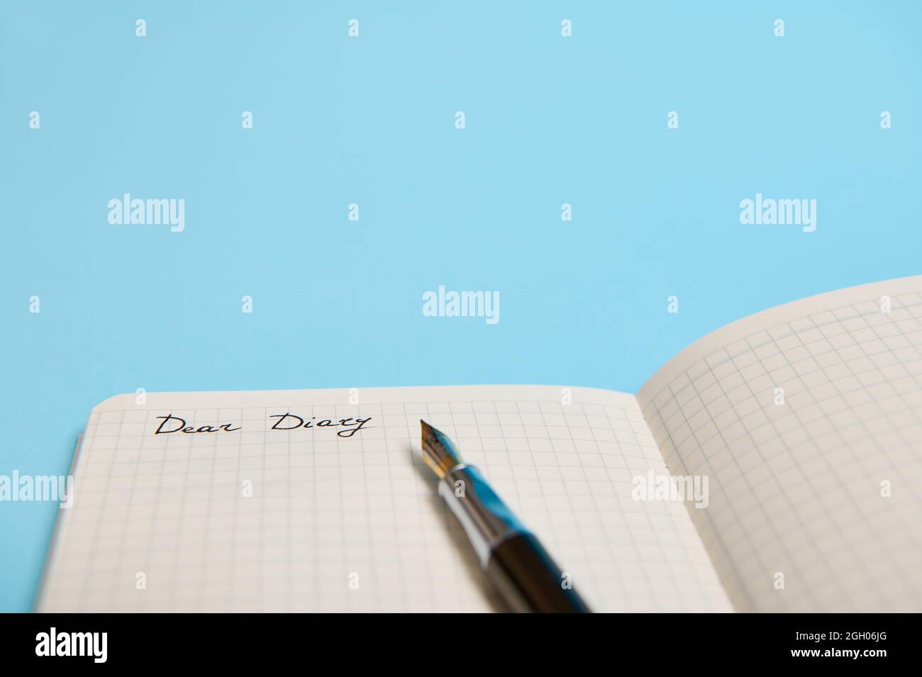 Cropped studio shot of an open notebook, organizer, diary with word ...