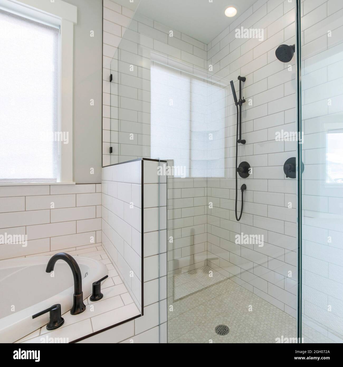 Square frame Shower stall with tiles and cohesive plumbing fixtures ...