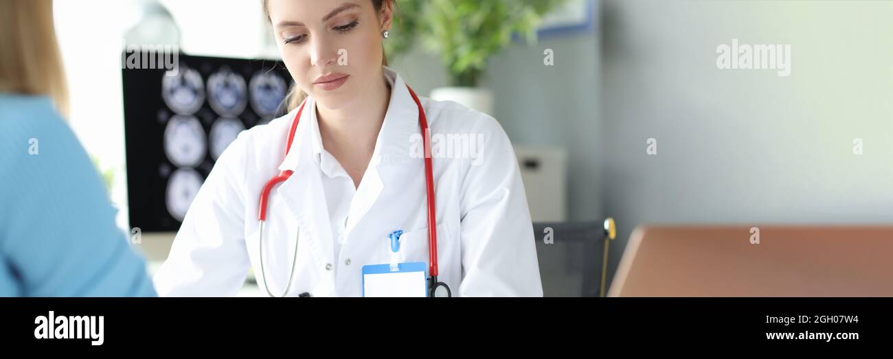 Woman cardiologist measuring blood pressure to patient in clinic Stock ...