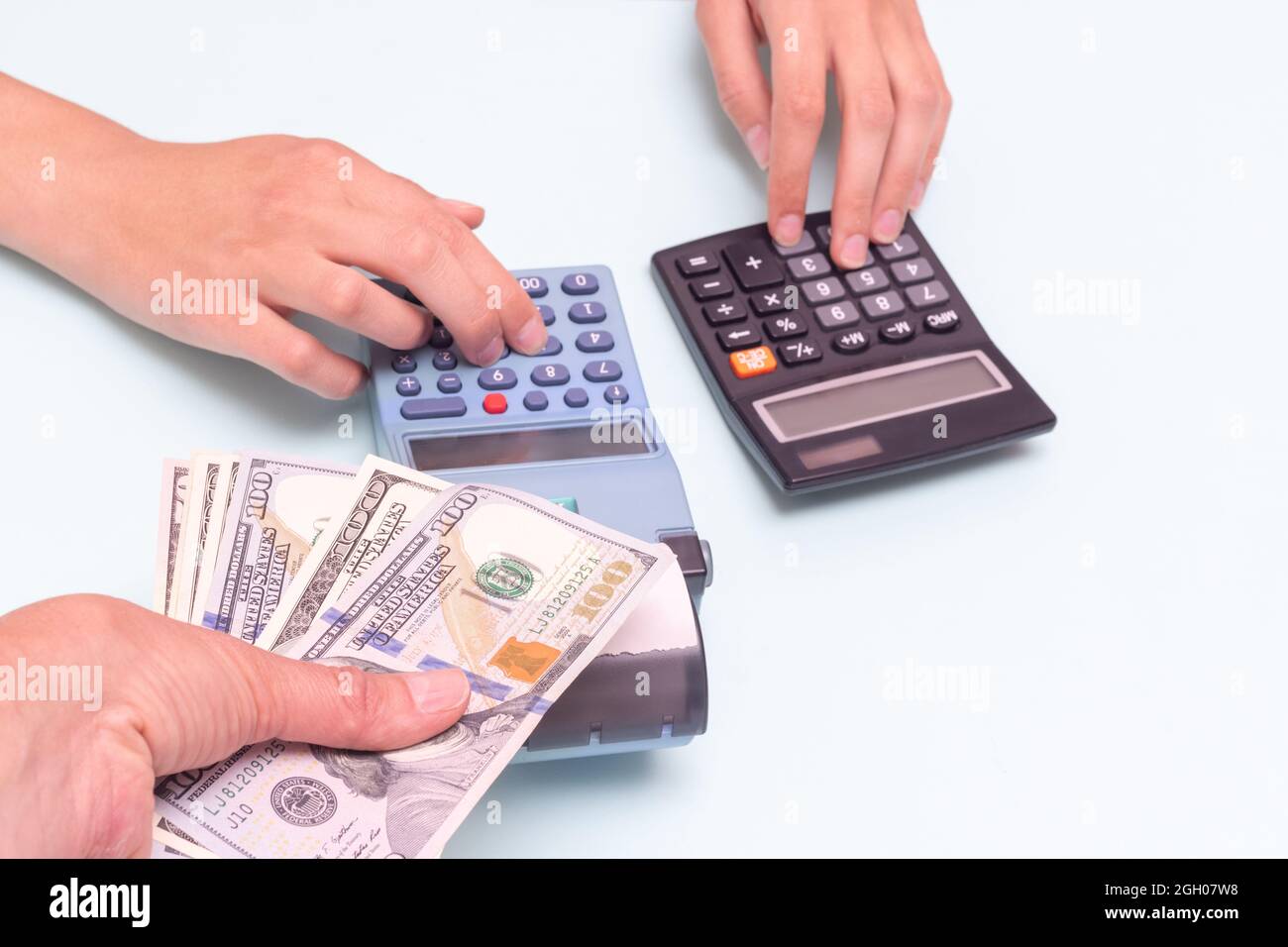 Cash payment concept. A hand giving cash for a purchase, a hand ...