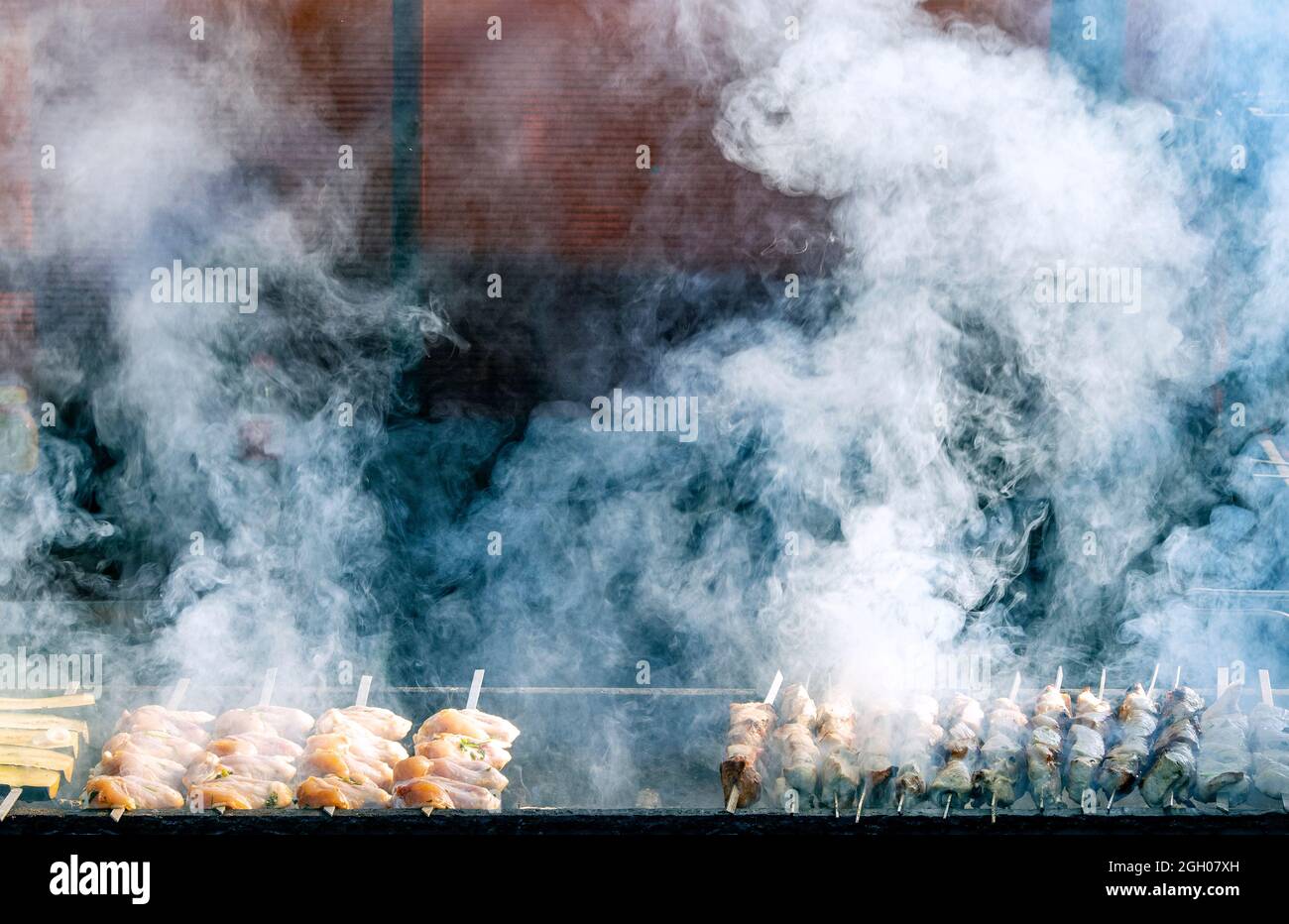 Barbecue, bbq smoke and fire, grilled meat. Heavy smoke over barbeque ...