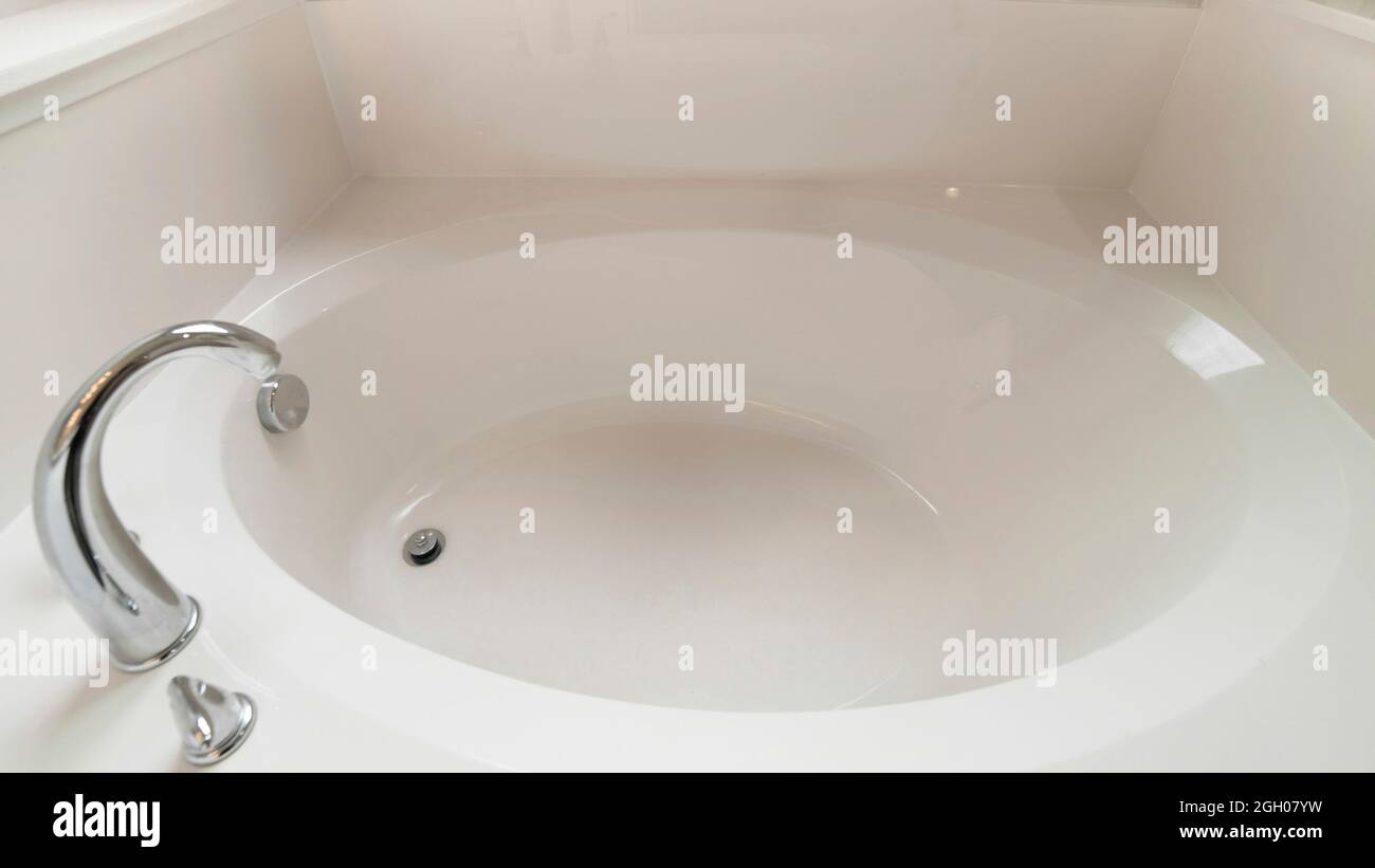 Pano Interior of a bathroom with bathtub, drainage and faucet Stock ...