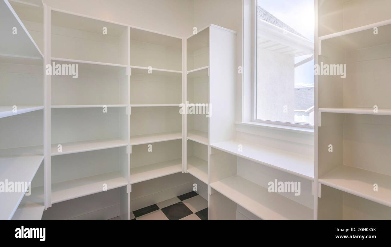 Pano Interior of an empty kitchen pantry in a house with window Stock ...