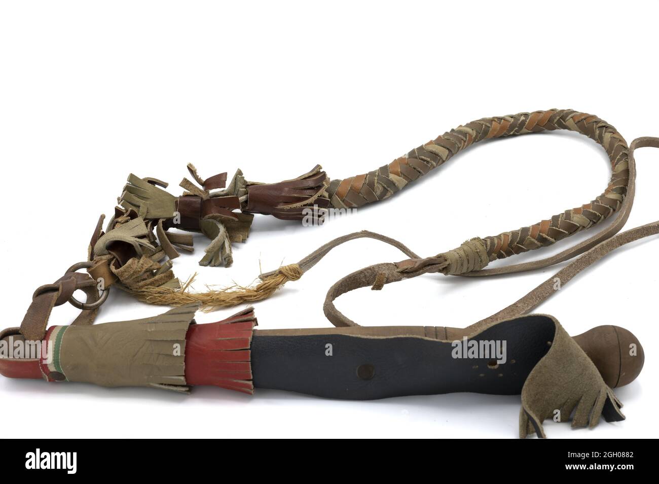 Closeup of an old leathercraft whip isolated on a white background ...
