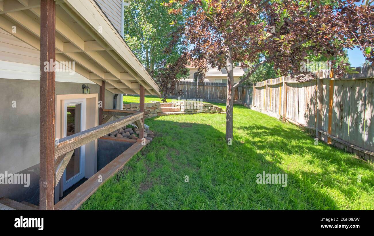 Pano Separate basement apartment entrance with stairs, glass panel and ...