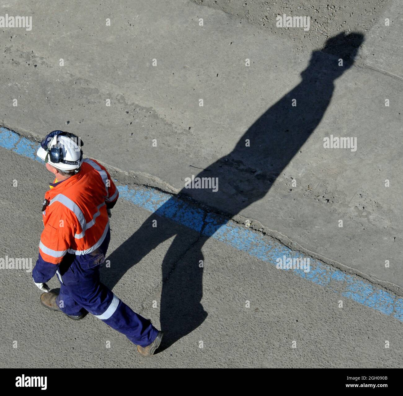 overhead view of a refinery worker onsite in ppe-personal protection ...