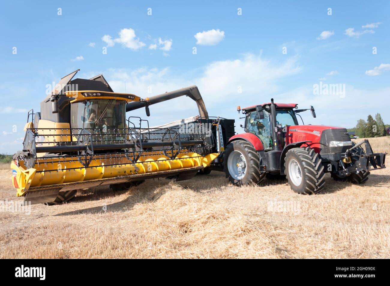 Combine Harvester Unloading Corn Stock Photo - Alamy