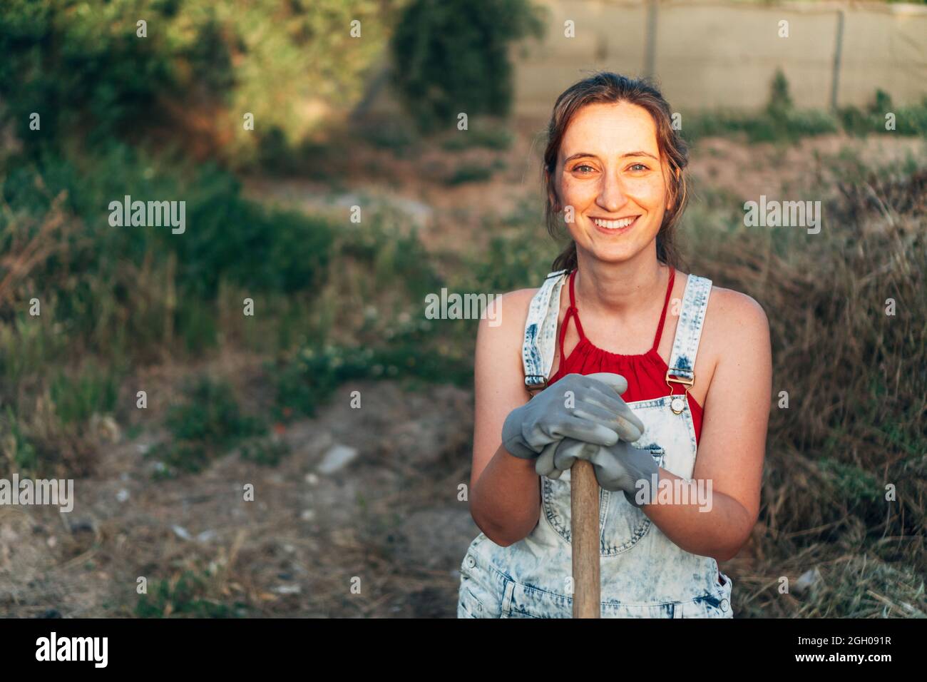 Portrait of a young peasant girl in the countryside with the last rays ...