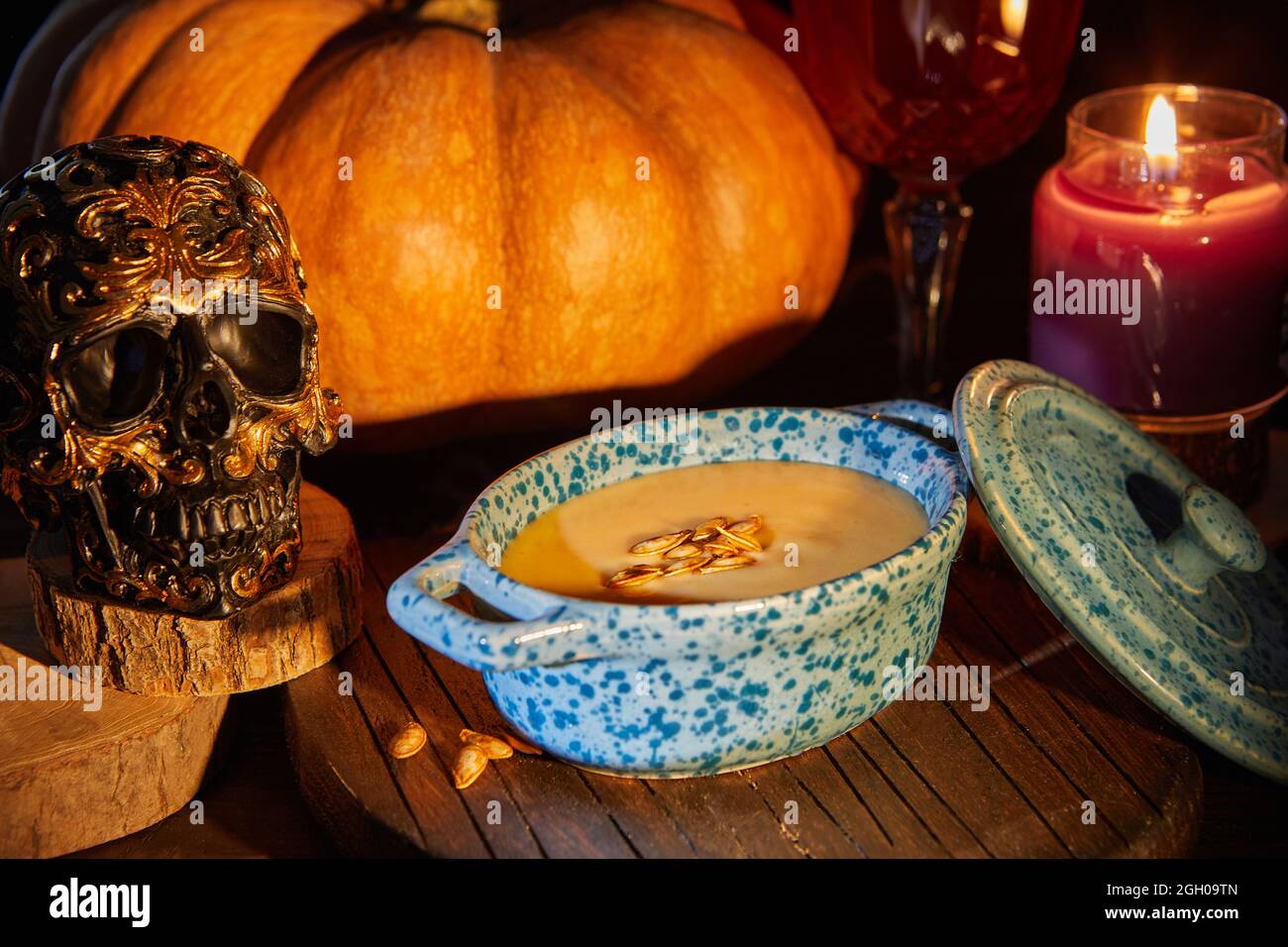 Scary Halloween skull with pumpkin and cream soup on spooky night ...