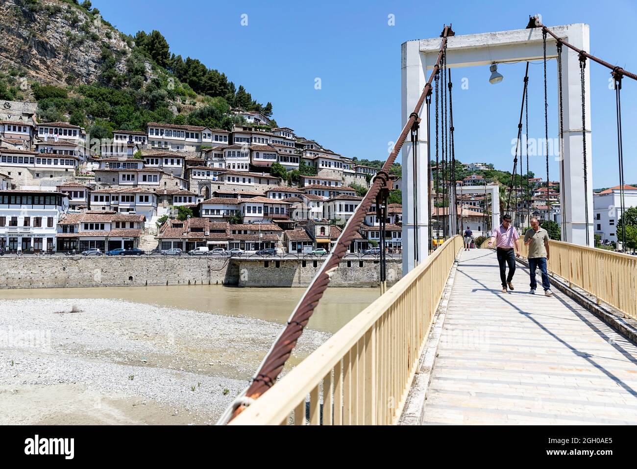 Local people crossing a bridge in an unesco city of berat albania Stock ...