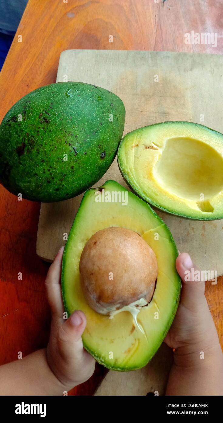 Top view single avocado hi-res stock photography and images - Alamy