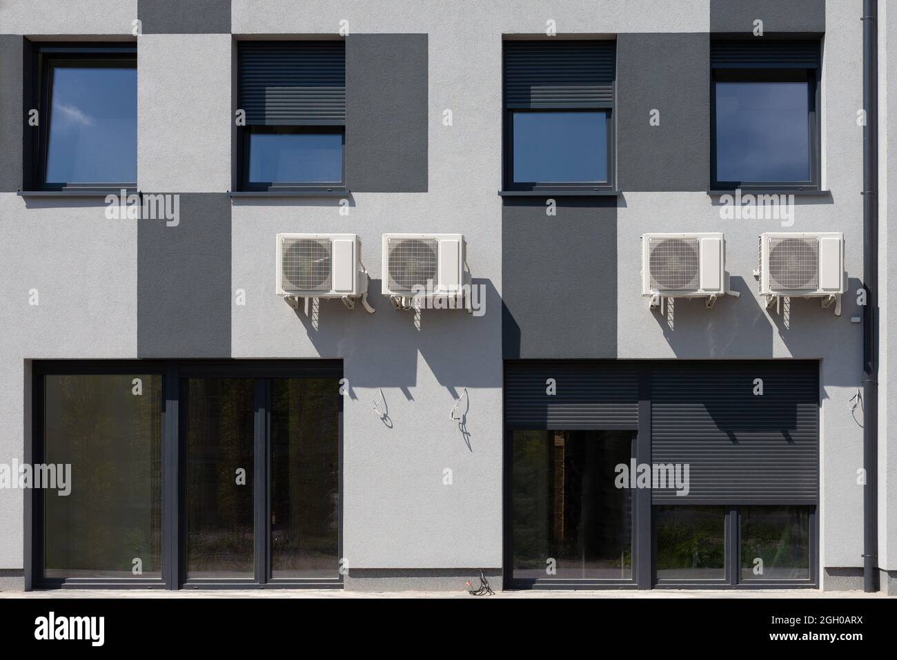 Exterior of a contemporary gray and white painted building Stock Photo ...