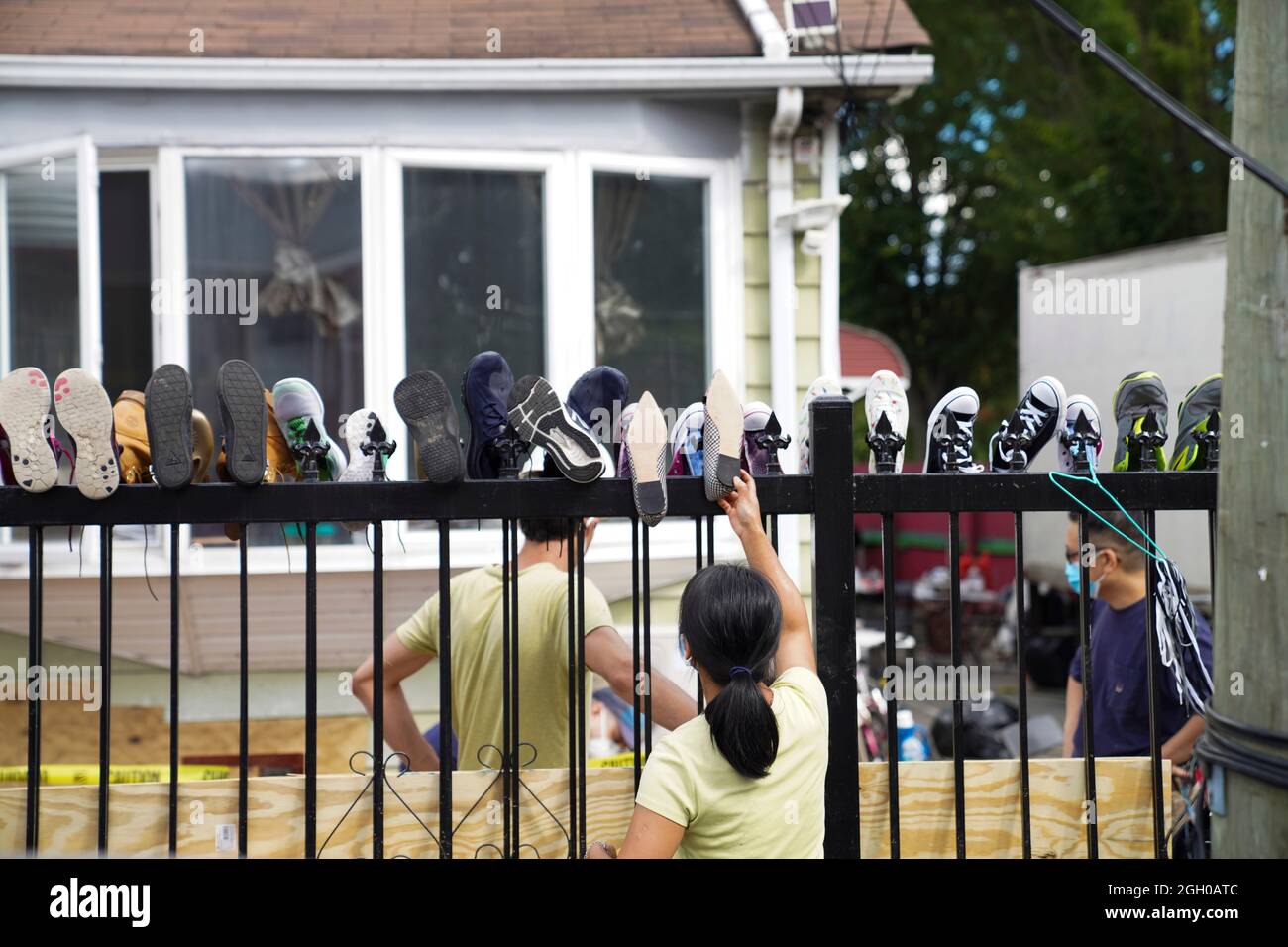 New York, USA. 3rd Sep, 2021. Waterlogged shoes are dried outside a ...