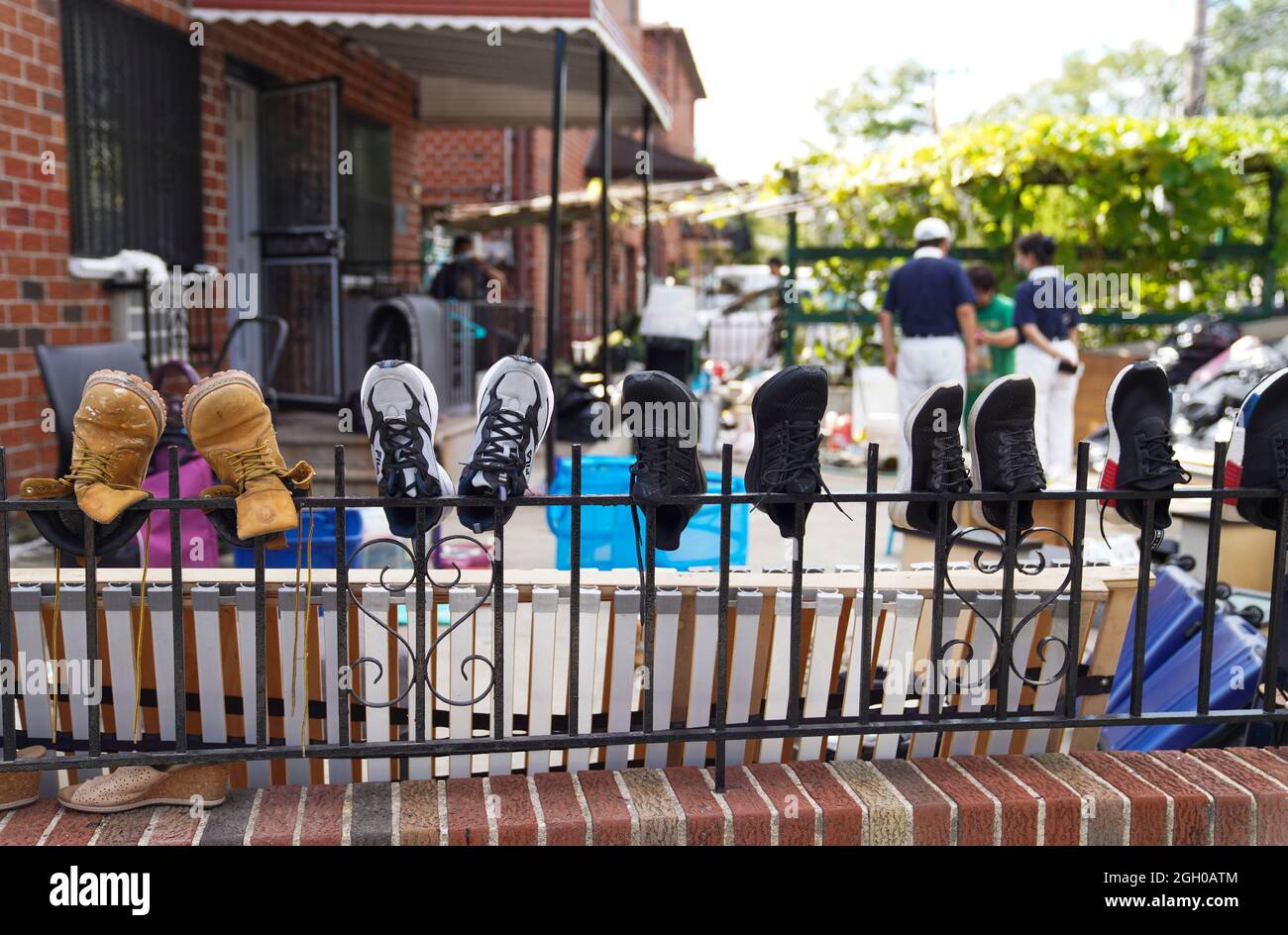 New York, USA. 3rd Sep, 2021. Waterlogged shoes are dried outside a ...