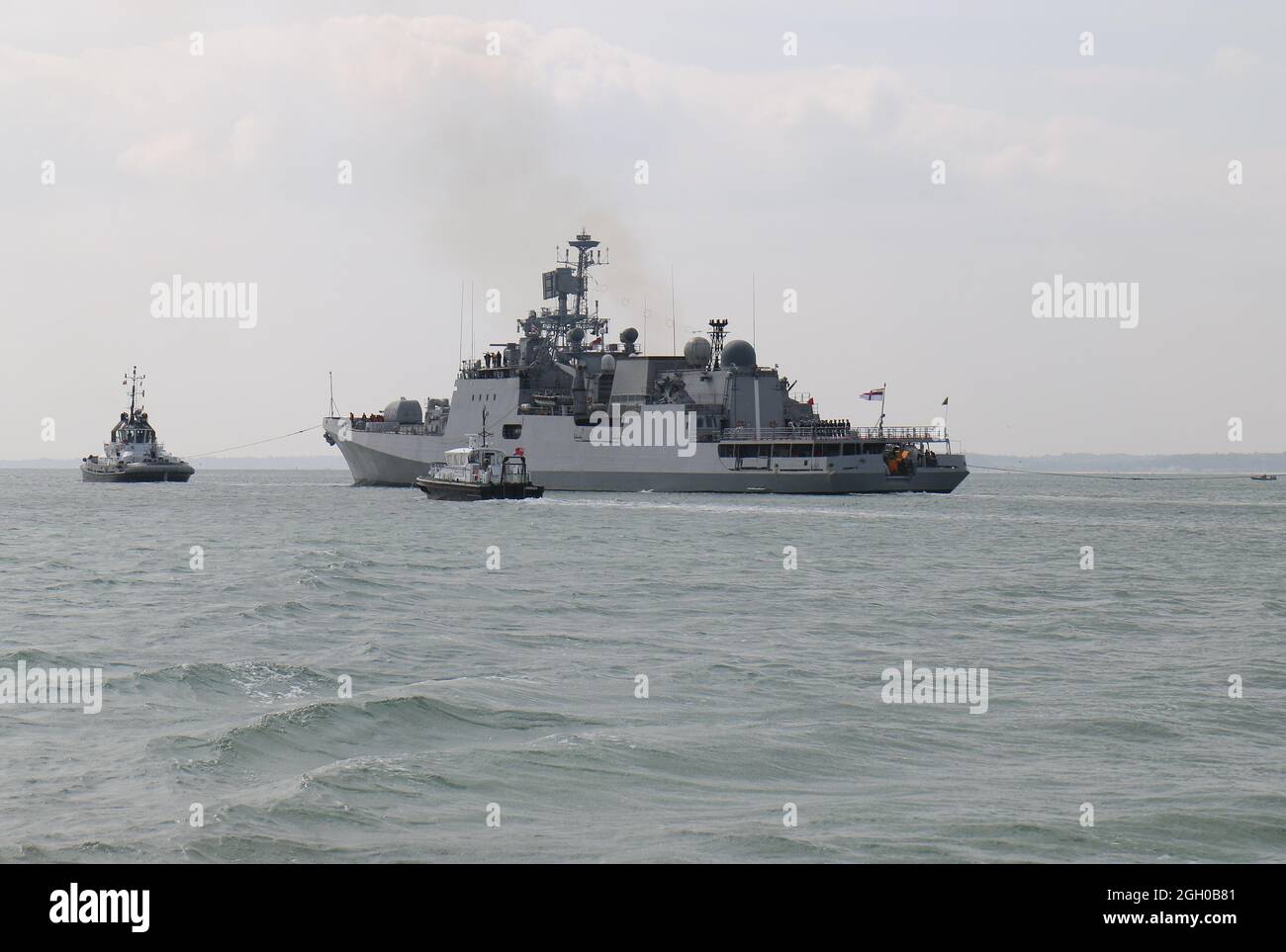 The Indian Navy ship INS TABAR departs from the Naval Base Stock Photo ...