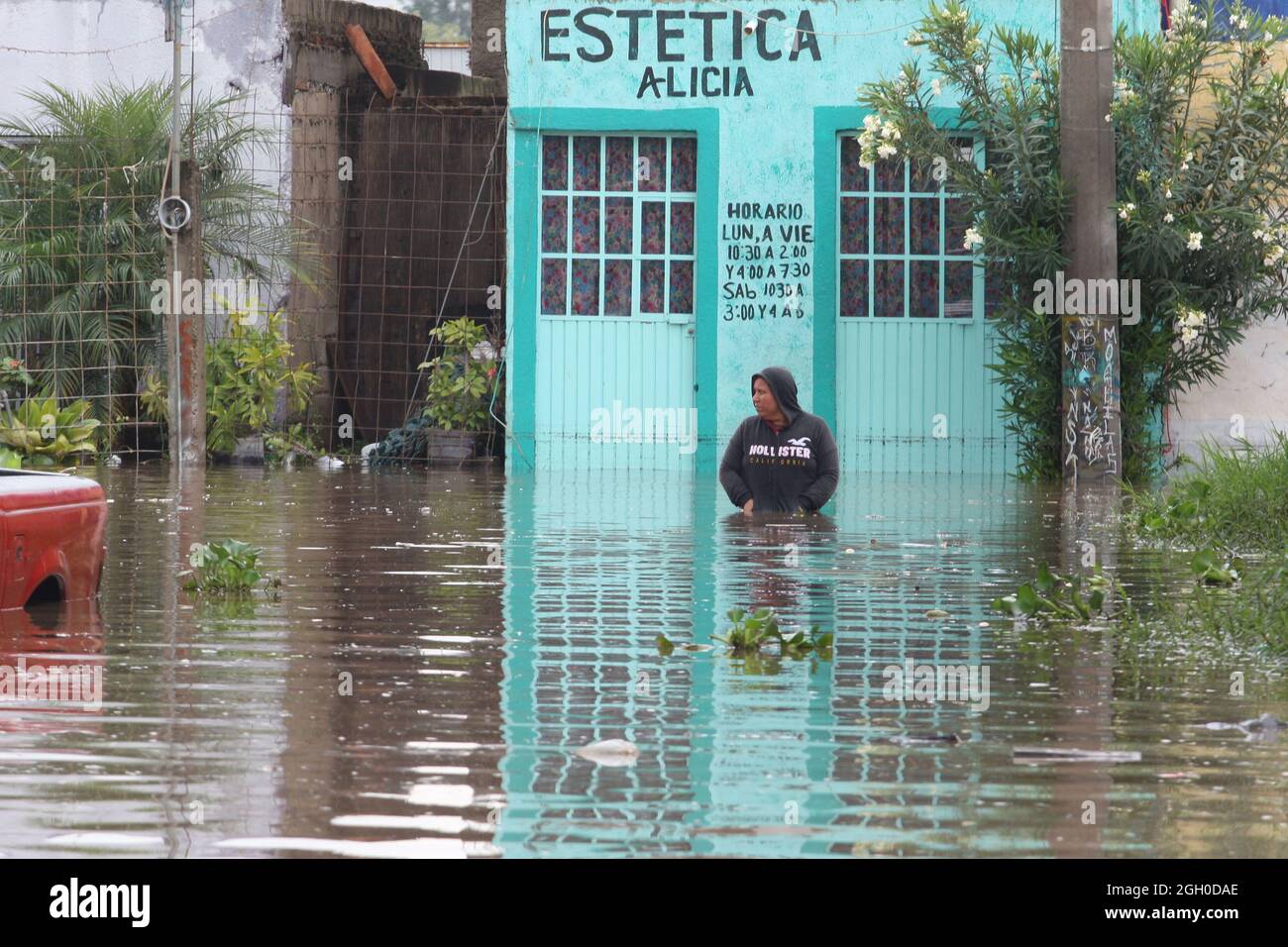 Jalisco, Mexico. 3rd Sep, 2021. A person is seen on a street flooded ...