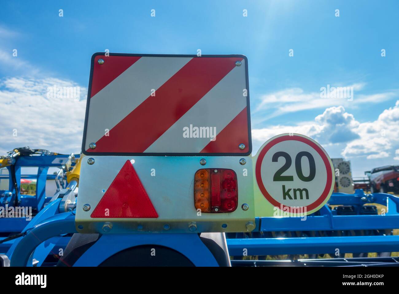 road-sign-on-a-plow-trailer-speed-limit-to-20-km-per-hour-stock-photo