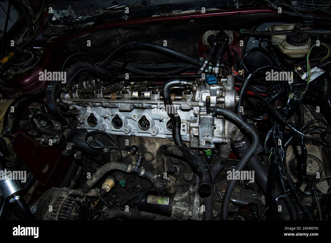 Open real car engines in the repair phase in a car mechanic shop Stock ...