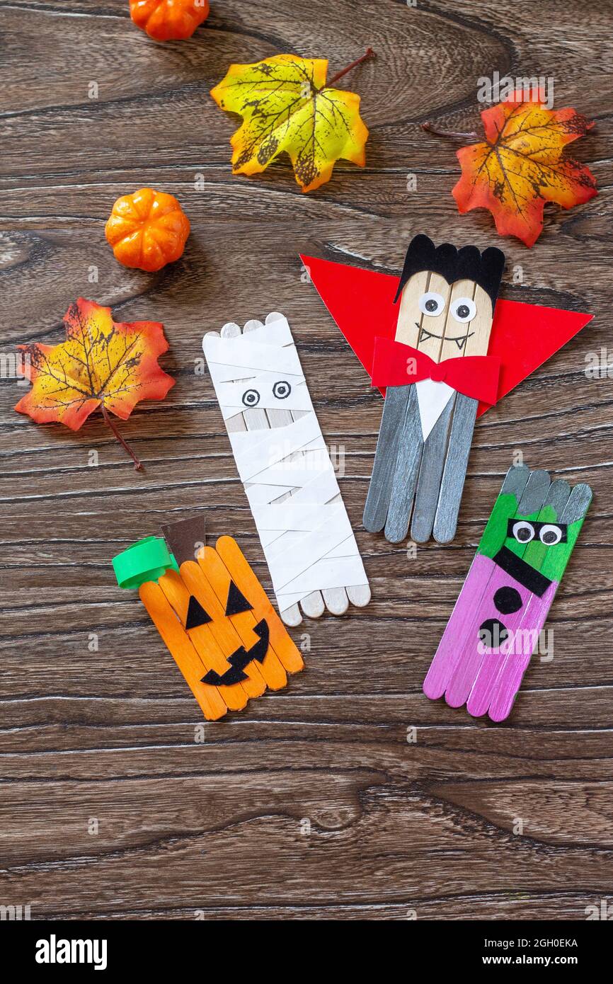 Halloween ghost and vampire toy gift stics puppets on wooden table ...