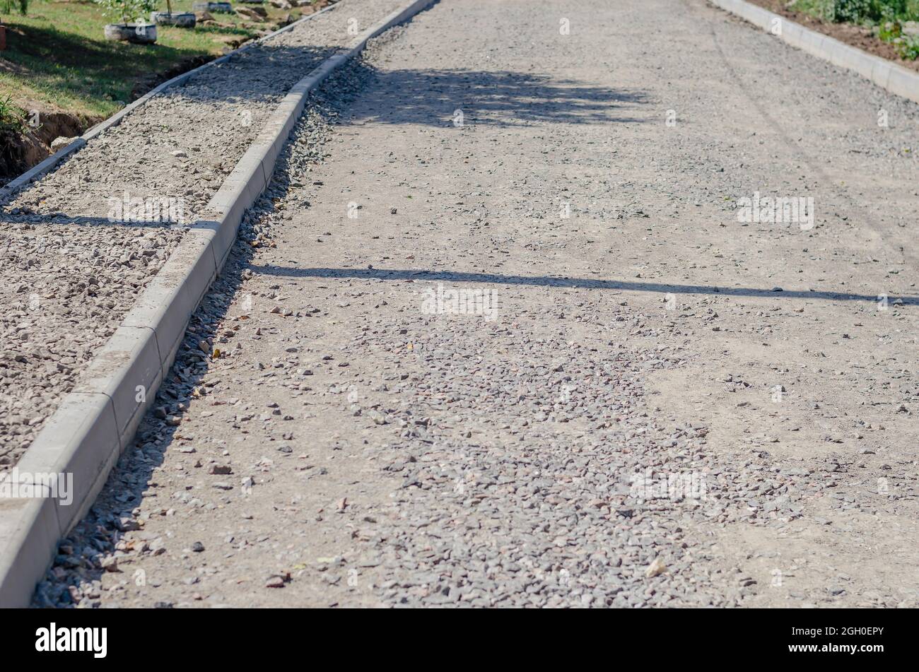 Construction of a new road and sidewalk. The roadway and walkway Stock ...