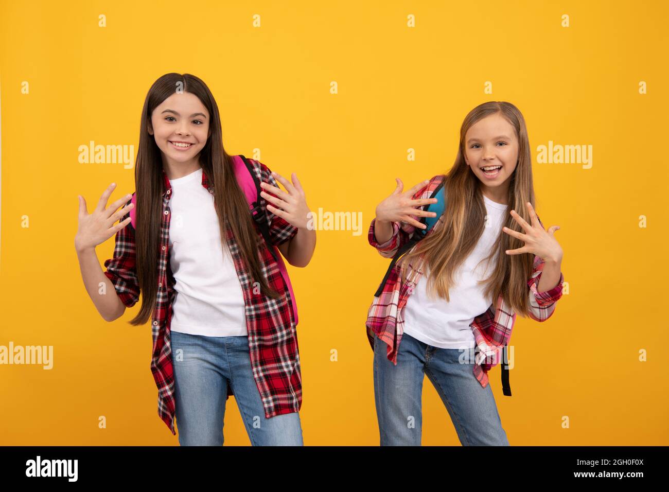 children with school bag. cool nice teen girls carry backpack. back to ...