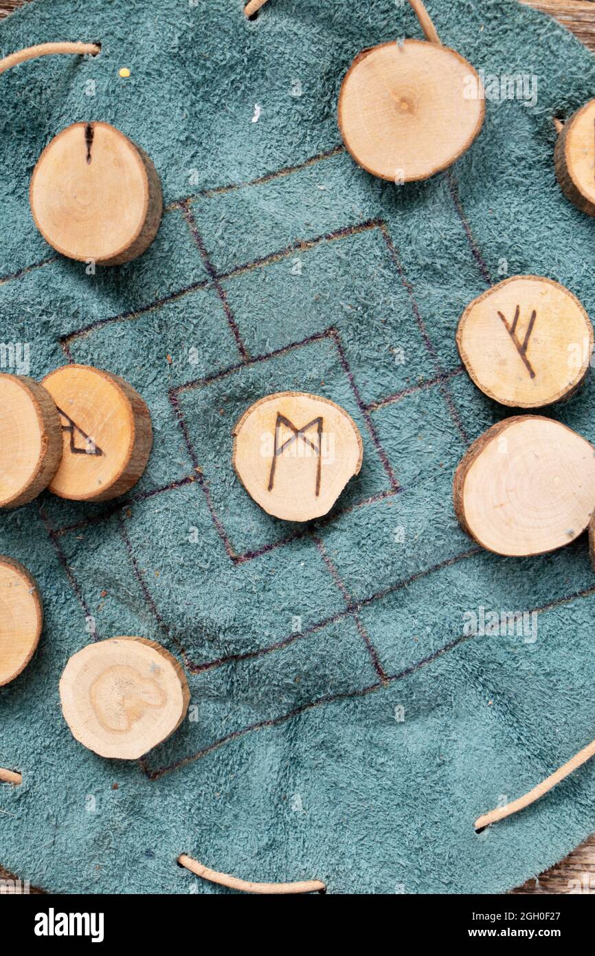 Handmade runes for fortunetelling Stock Photo - Alamy