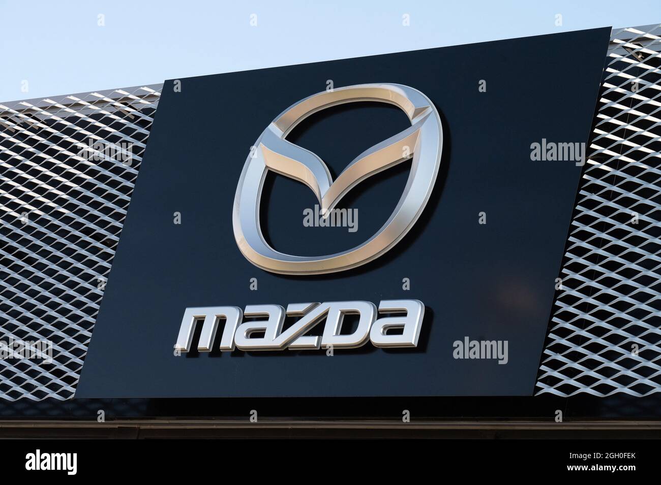 A shop sign of MAZDA, on September 03, 2021 in Angouleme, France. Photo ...