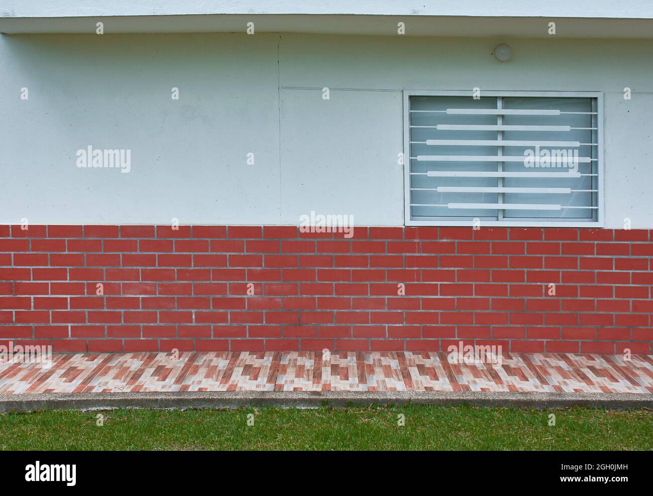 Exterior view of a building with a brick wall Stock Photo - Alamy