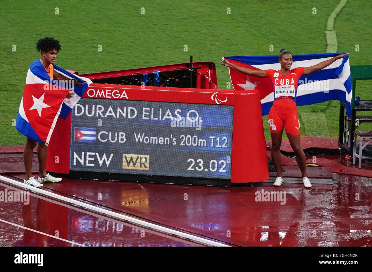 Omara Elias Durand with guide Yuniol Vargas Kindelan following victory ...