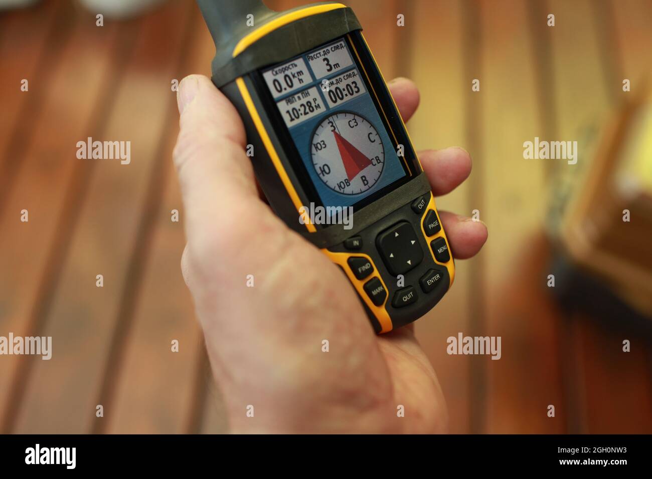 tourist navigator in the hands of a person with a map of the area and a ...