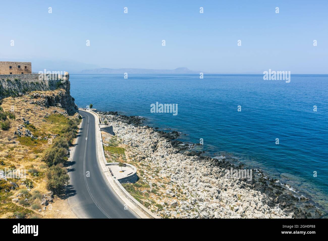 Aerial shot of the ancient castle of Fortezza surrounded by a blue ...