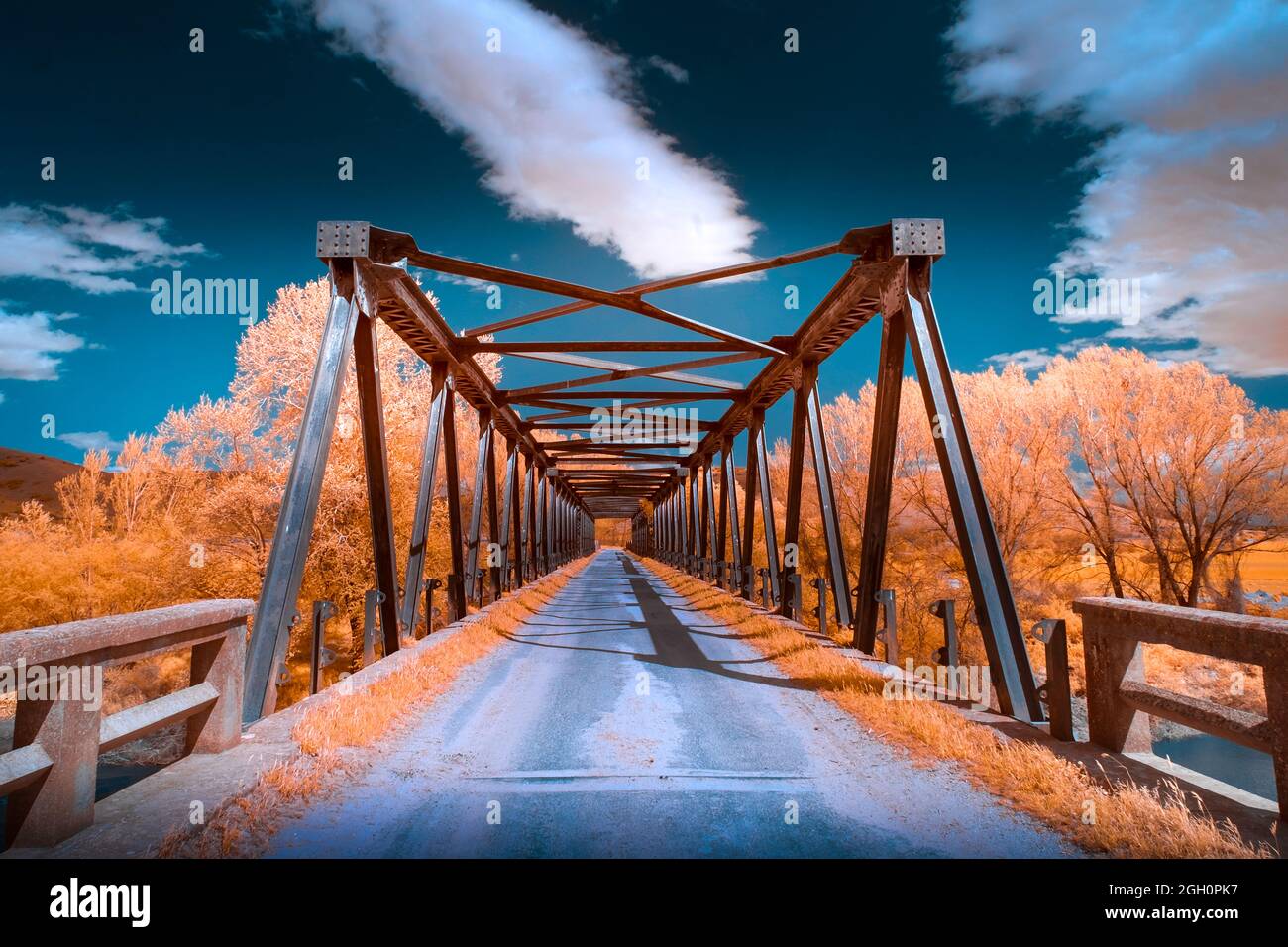Infrared landscape scene of an old steel bridge Stock Photo - Alamy