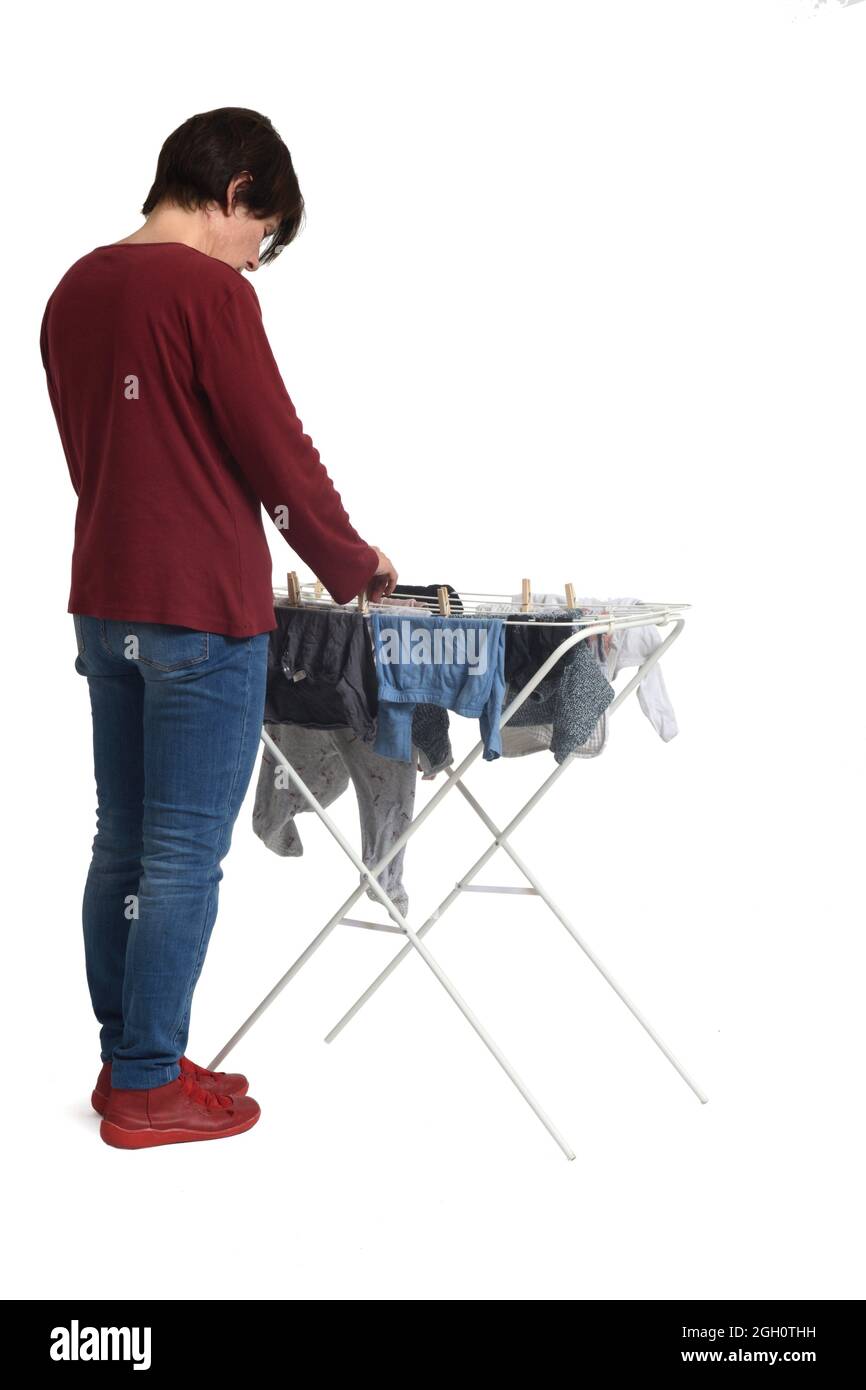 Woman hanging clothes washing Cut Out Stock Images & Pictures - Alamy