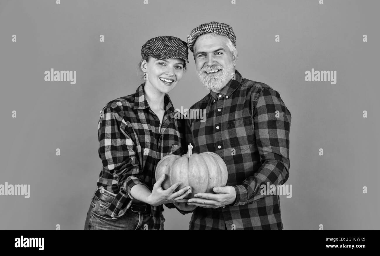 Symbol of the celebration. happy man and woman checkered shirt and hat ...